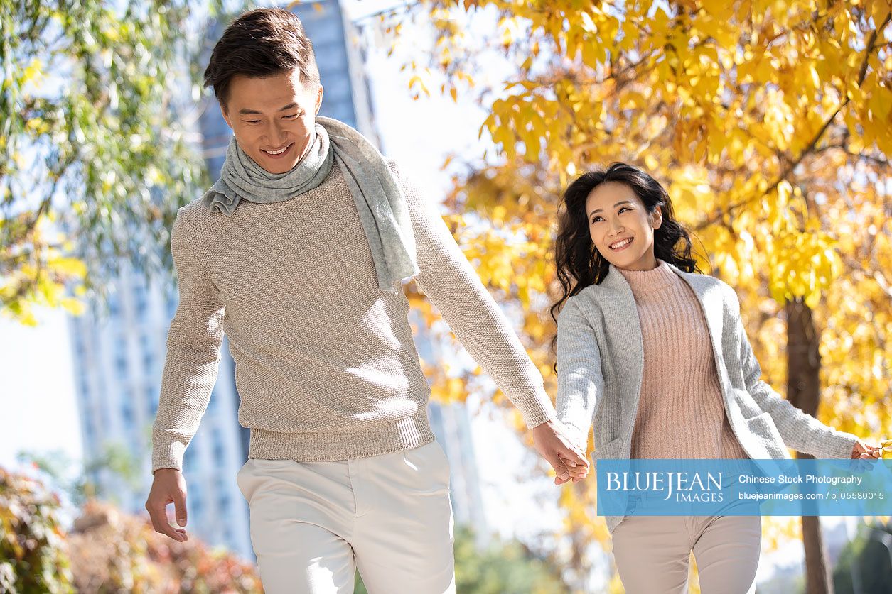 Happy young Chinese couple dating in autumn-High-res stock photo for download