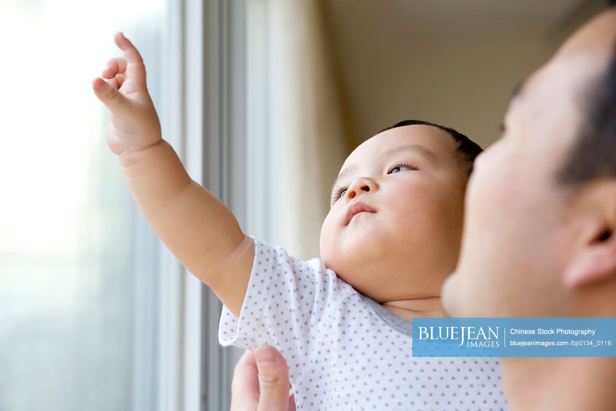 Chinese man with infant-High-res stock photo for download