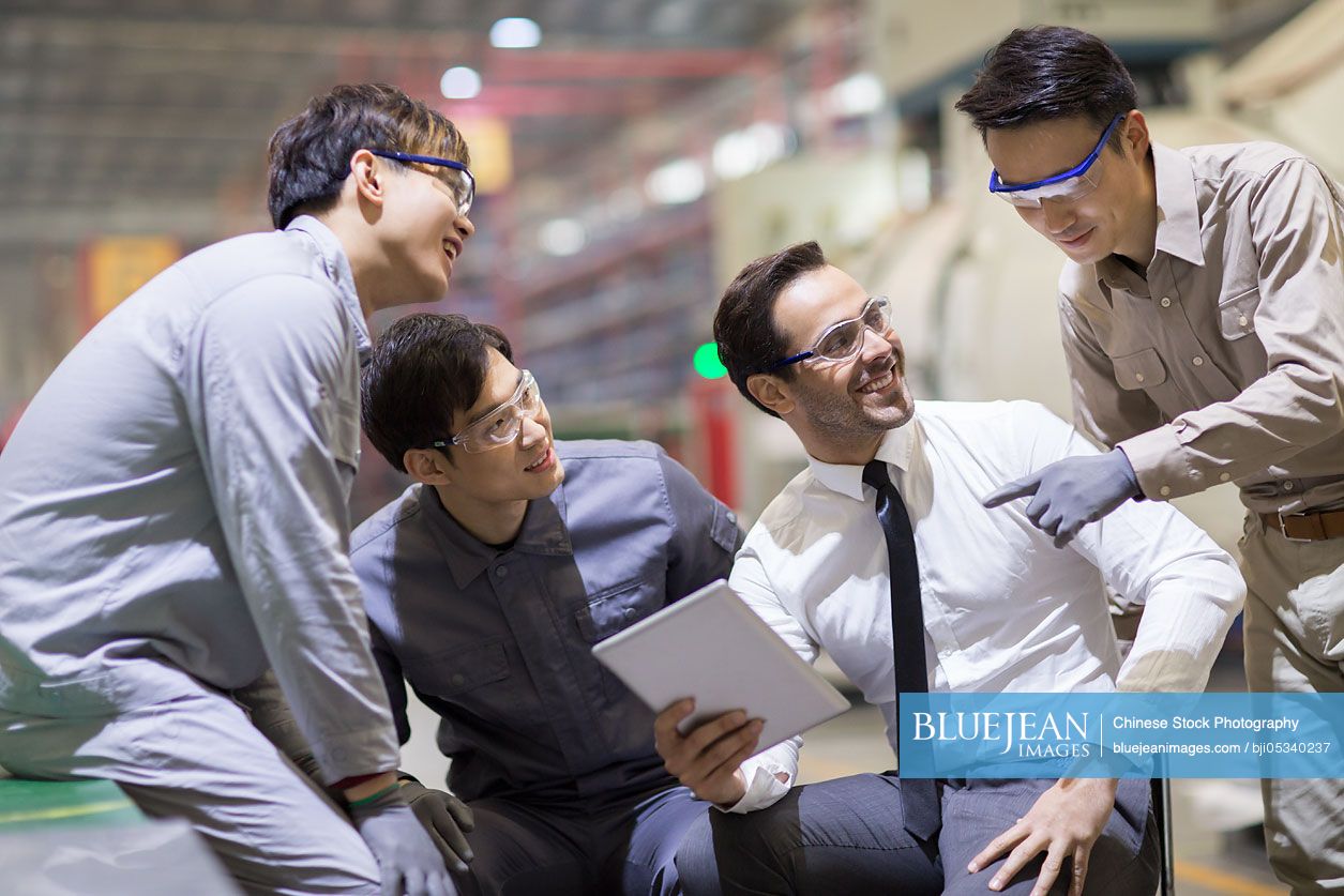Businessman and engineers talking in the factory-High-res stock photo ...