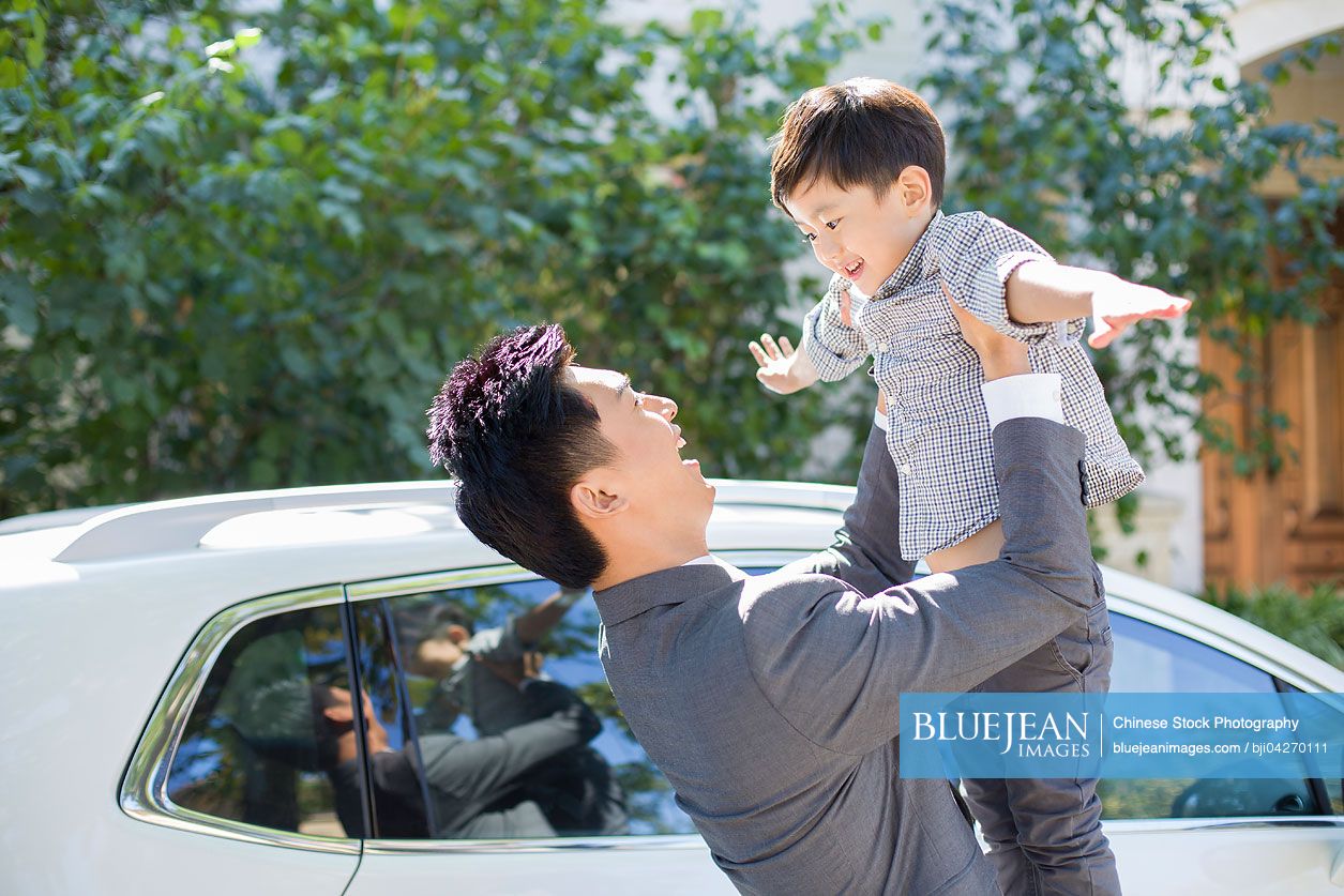 Chinese father playing with his son-High-res stock photo for download