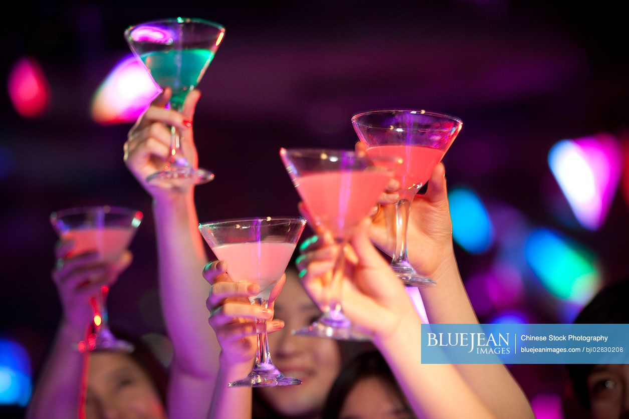 Stylish young Chinese giving a toast-High-res stock photo for download