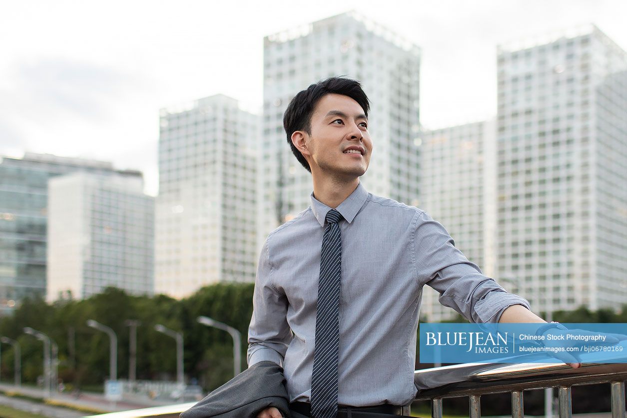 Confident Chinese businessman looking at view-High-res stock photo for ...