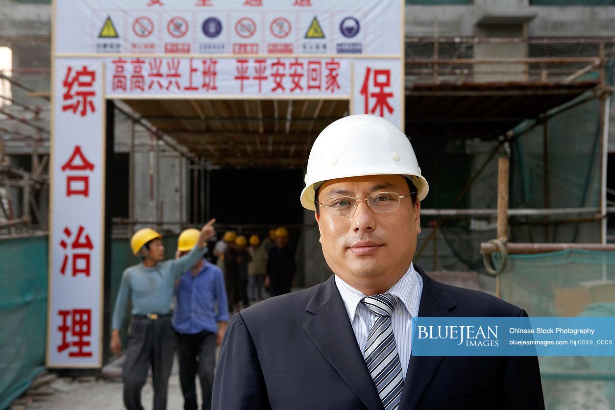 Chinese Businessman In A Construction Site Wearing A Hard Hat-High-res ...