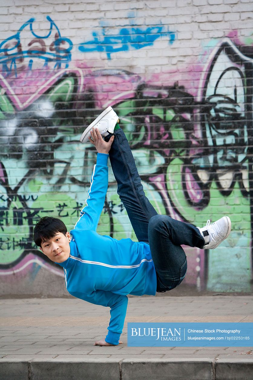 Hip young Chinese man break dancing-High-res stock photo for download