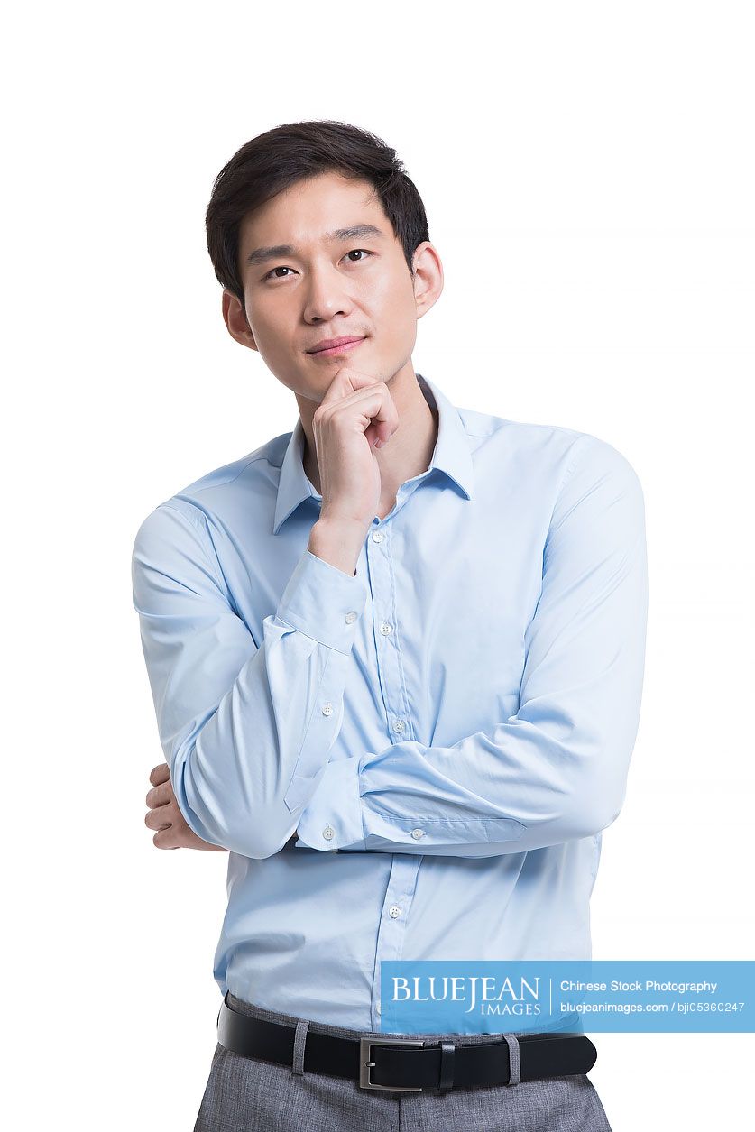 Confident young Chinese businessman thinking-High-res stock photo for ...