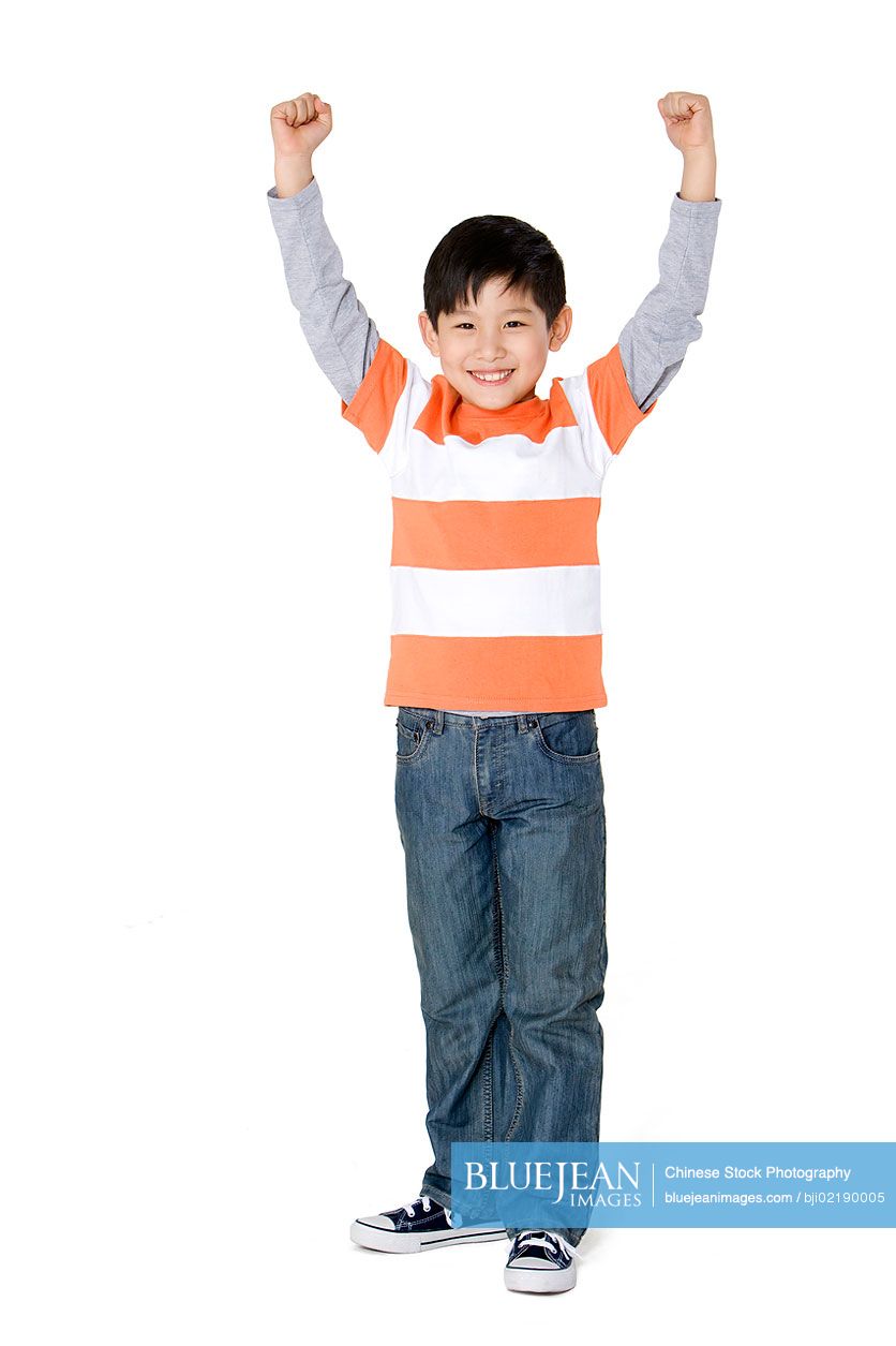 Young Chinese boy smiling with arms outstretched-High-res stock photo ...
