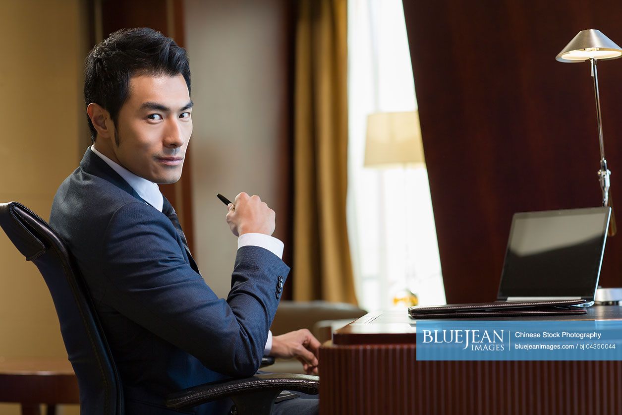 Portrait of successful Chinese businessman in study-High-res stock ...