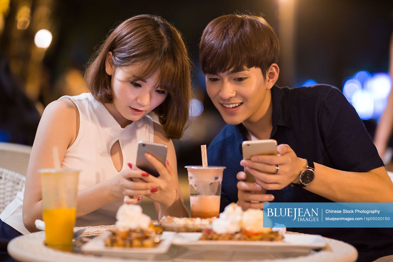 Happy young Chinese couple dating-High-res stock photo for download