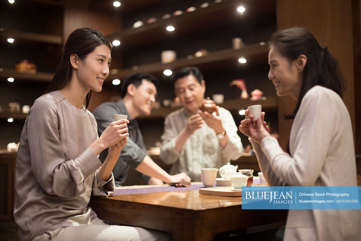 Chinese friends drinking tea together-High-res stock photo for download