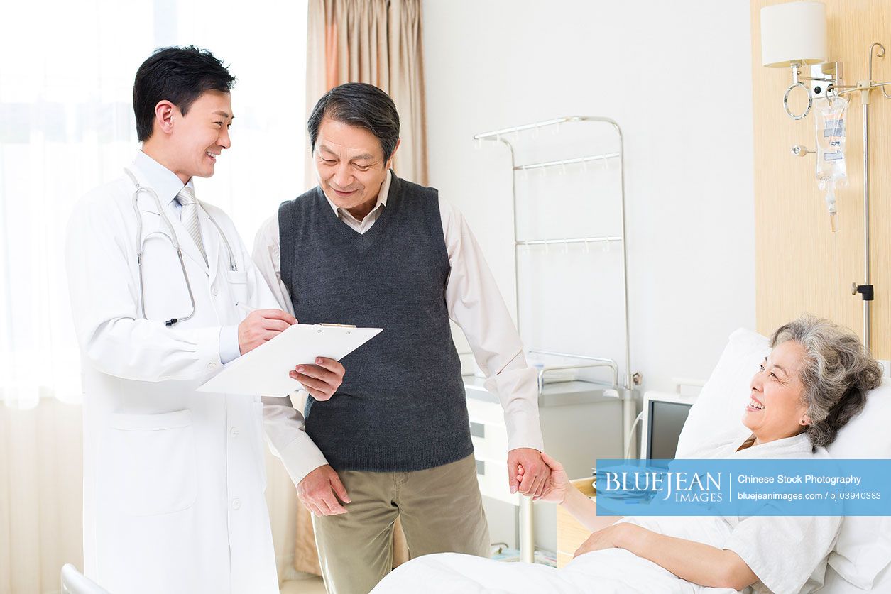 Chinese doctor with senior couple in hospital-High-res stock photo for ...
