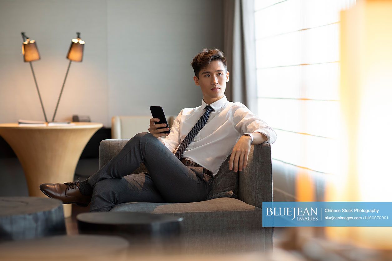 Young Chinese businessman and smart home-High-res stock photo for download