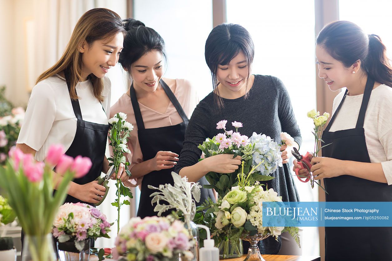 Young Chinese women learning flower arrangement-High-res stock photo ...