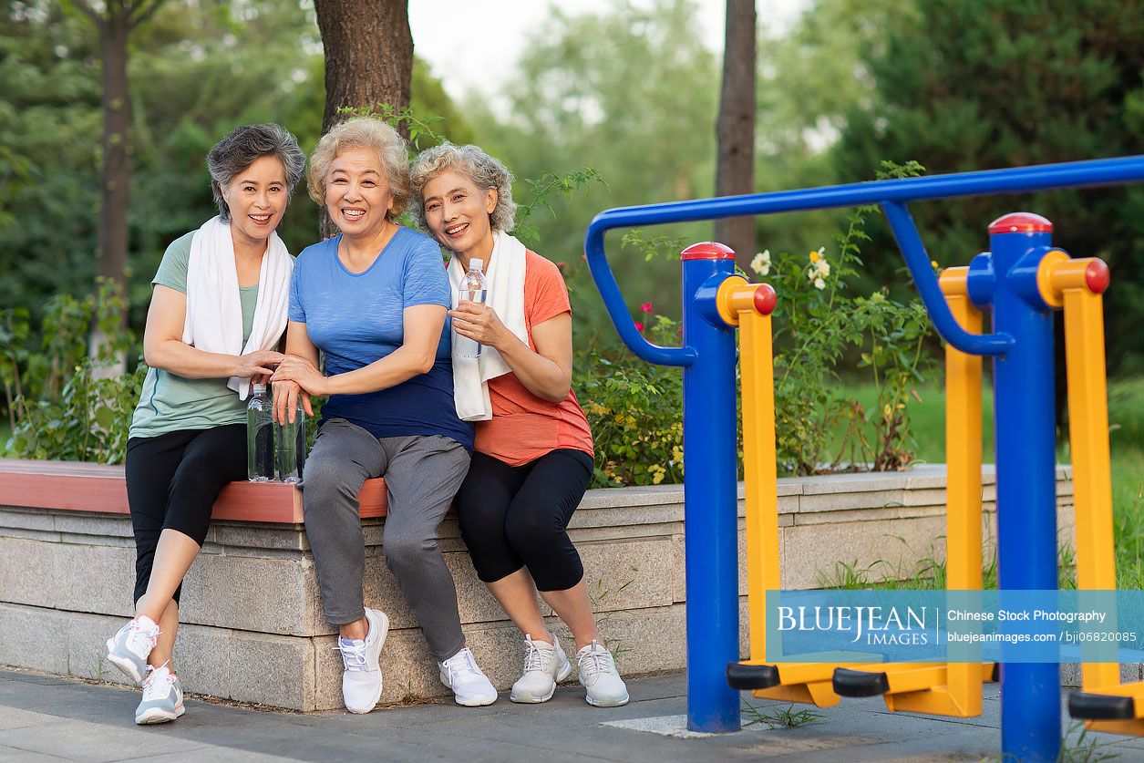 Happy senior Chinese friends relaxing in park-High-res stock photo for ...