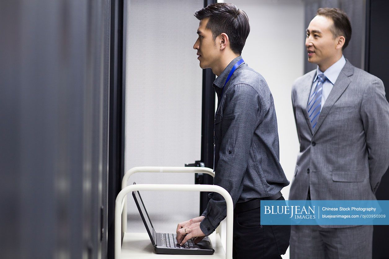 Technicians doing maintenance in computer room-High-res stock photo for ...