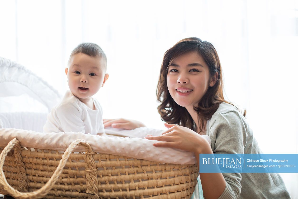 Happy Chinese mother and cute baby at home-High-res stock photo for ...