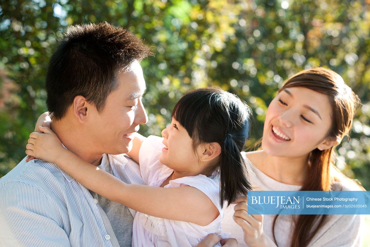 Young Chinese family in a park-High-res stock photo for download