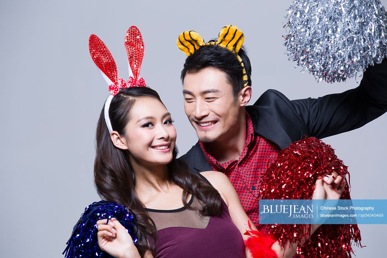 Happy young Chinese couple at a party-High-res stock photo for download