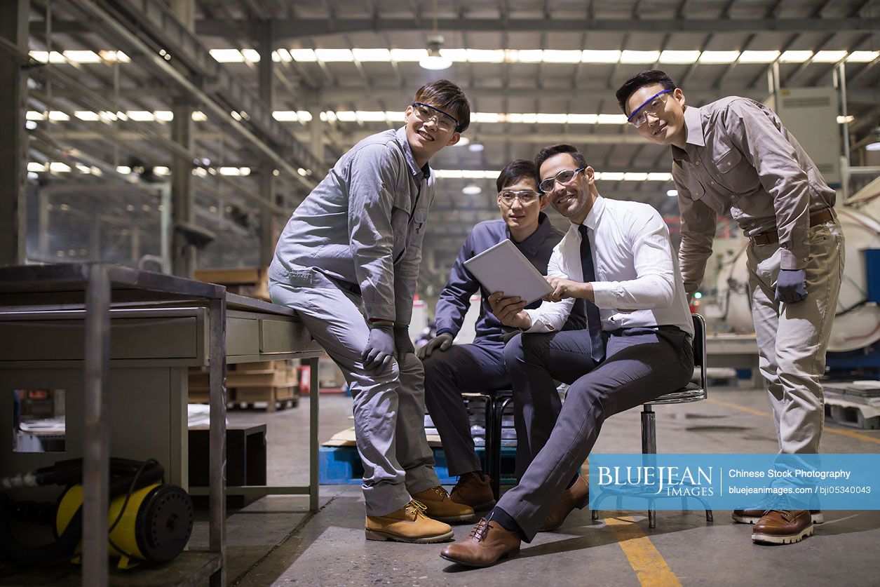 Businessman and engineers talking in the factory-High-res stock photo ...