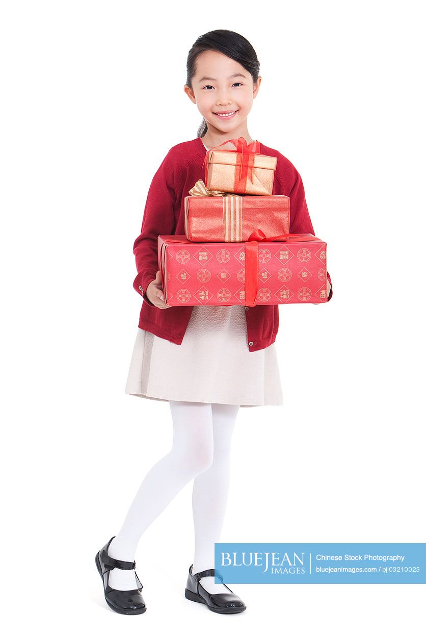 Portrait of little Chinese girl with gift boxes in hands-High-res stock ...