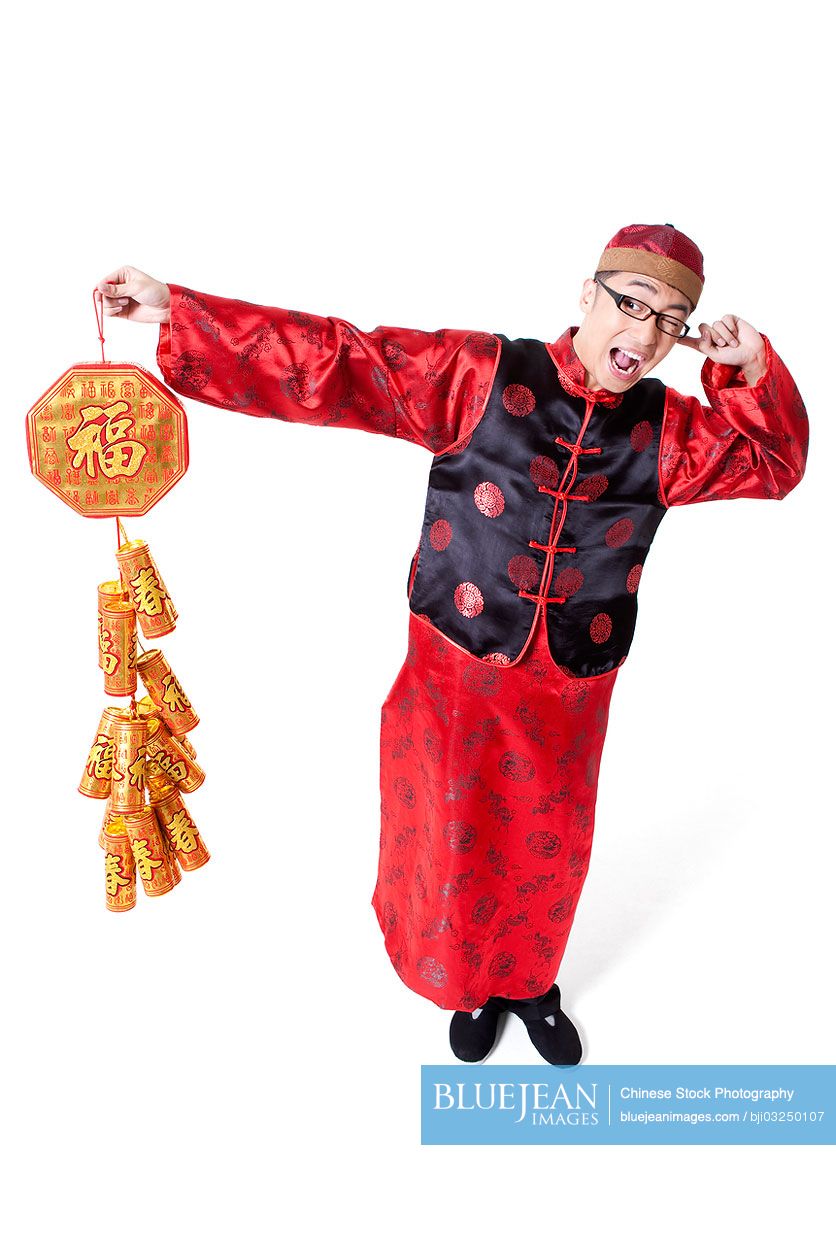 Excited young Chinese man in Tang suit and fireworks-High-res stock ...