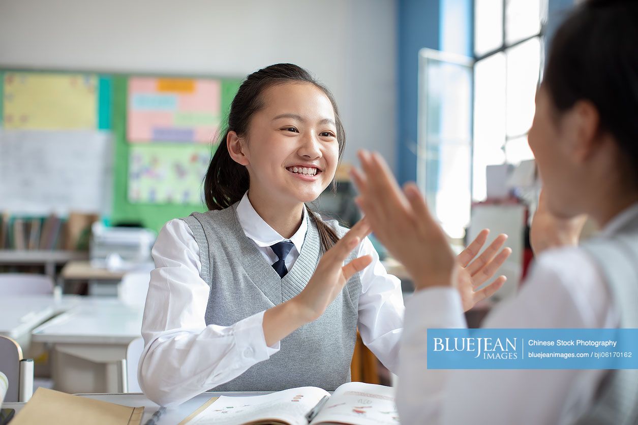 Students having fun in classroom-High-res stock photo for download