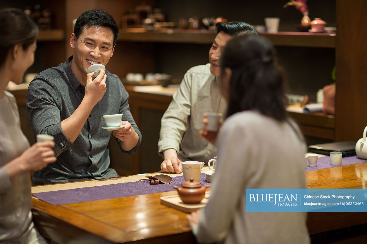 Chinese friends drinking tea together-High-res stock photo for download