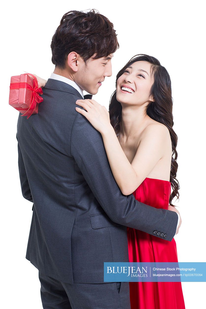 Young Chinese woman hugging boyfriend after receiving a gift-High-res ...