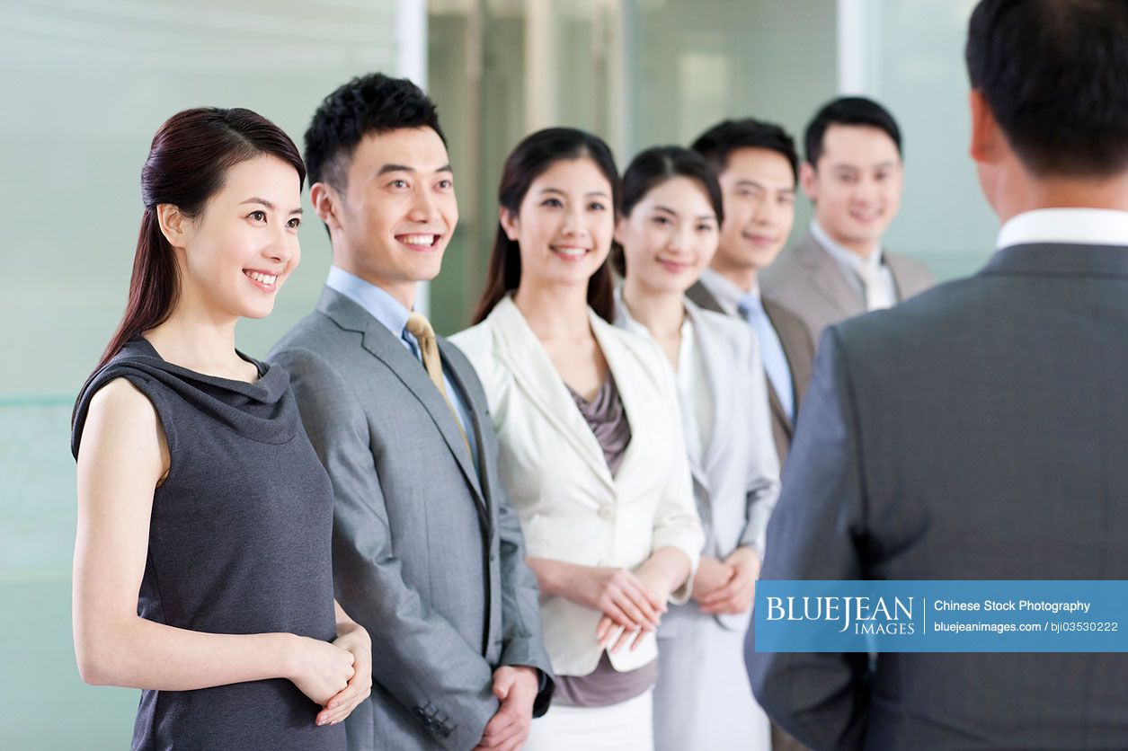 Cheerful Chinese business team having a meeting-High-res stock photo ...