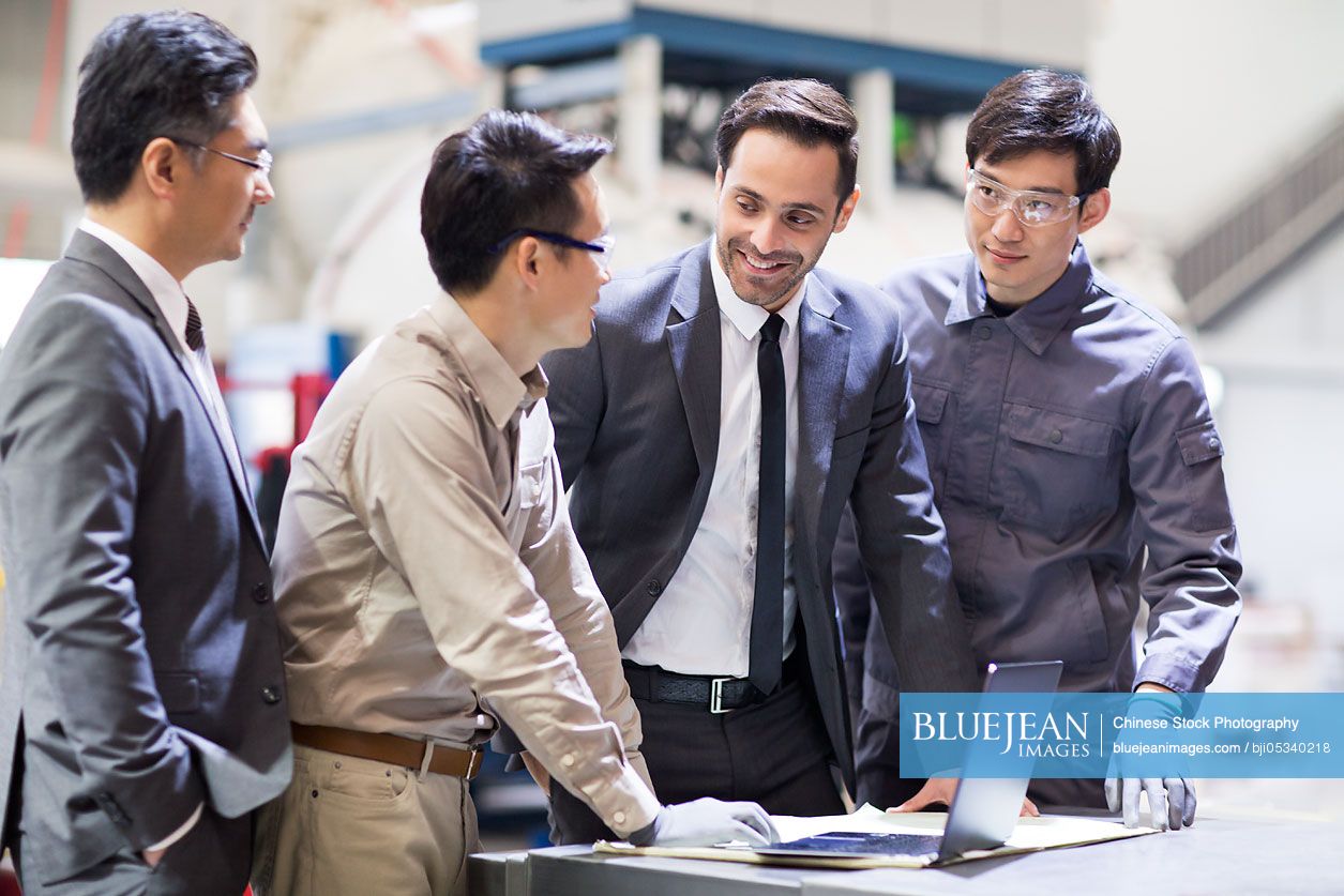 Businessmen and engineers talking in the factory-High-res stock photo ...