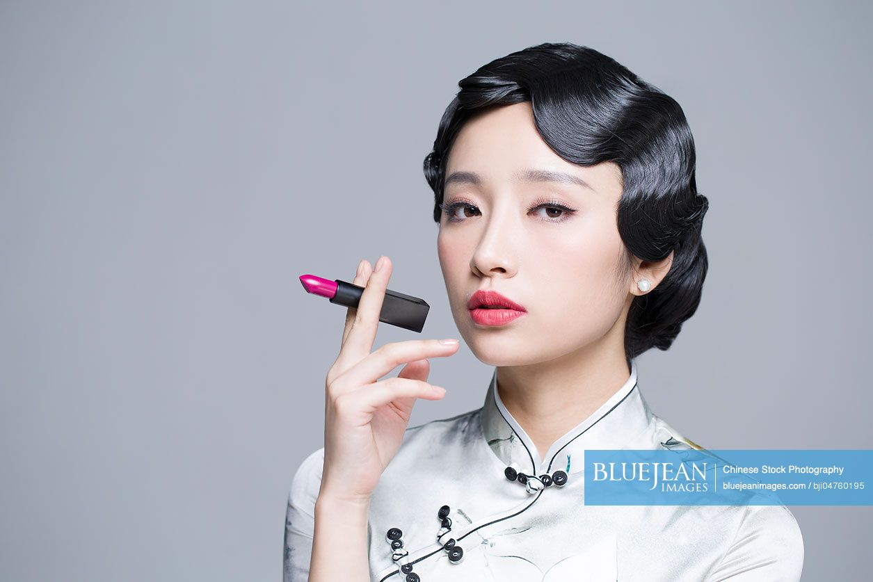 Young beautiful Chinese woman in traditional cheongsam with a lipstick-High-res stock photo for ...