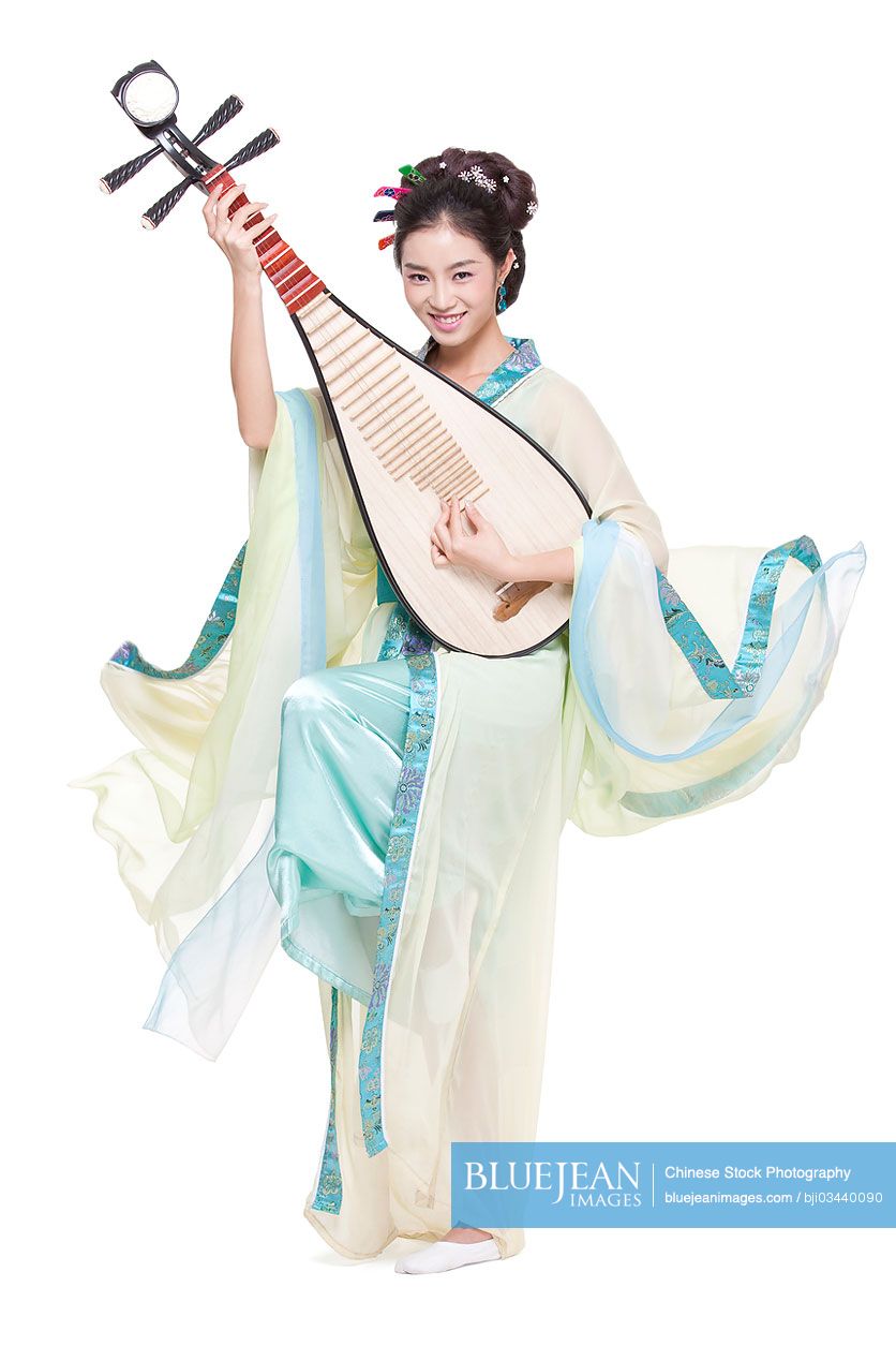 Young Chinese woman in Chinese traditional costume plucking Chinese ...