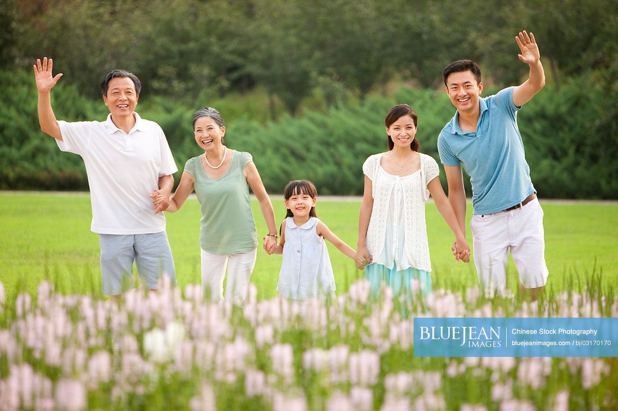 Happy Chinese family enjoying themselves outdoors-High-res stock photo ...