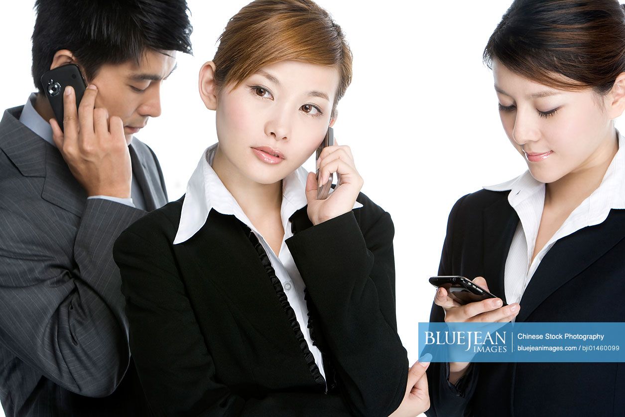 Chinese businessmen using cell phones-High-res stock photo for download