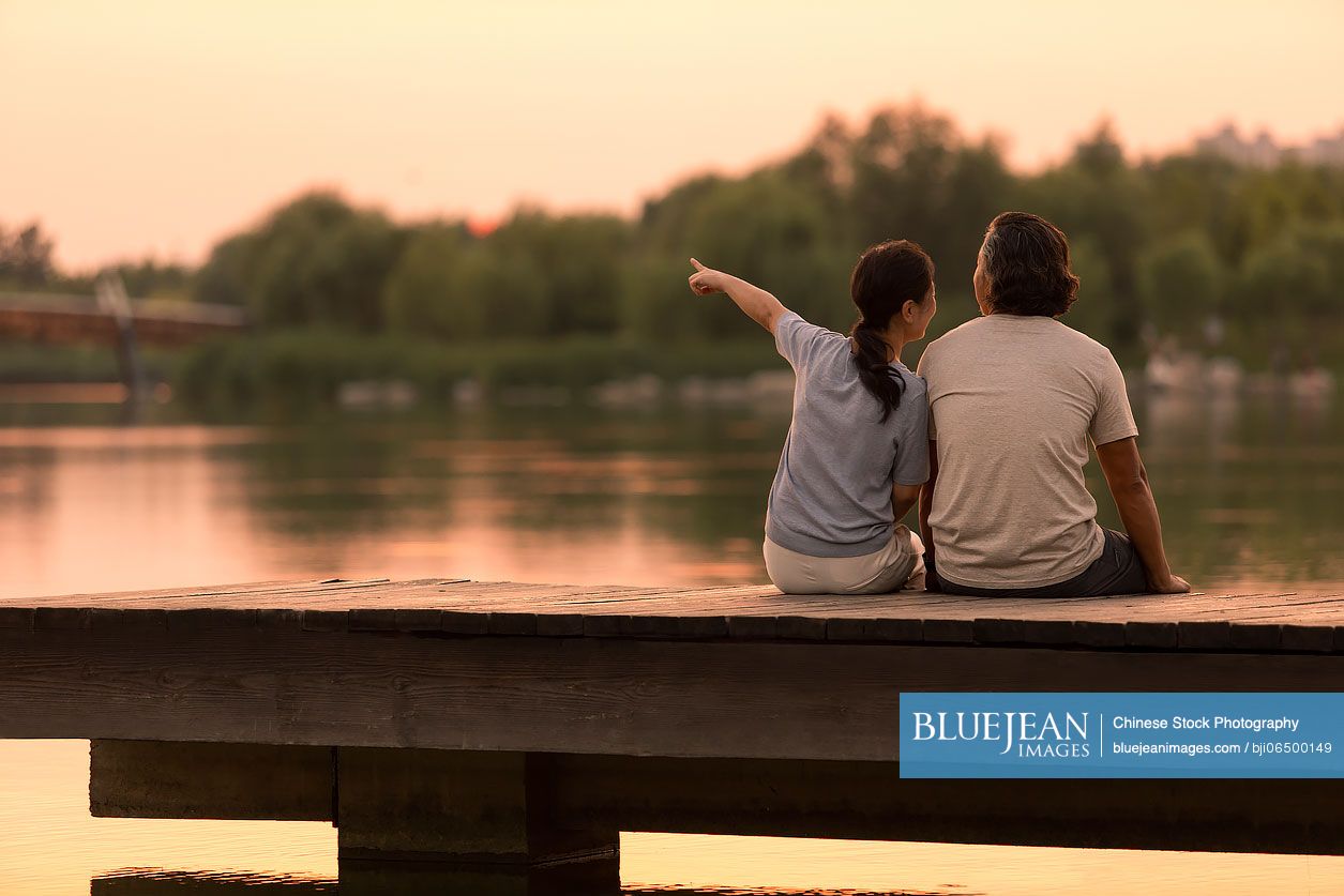 Happy mature Chinese couple relaxing in park-High-res stock photo for download