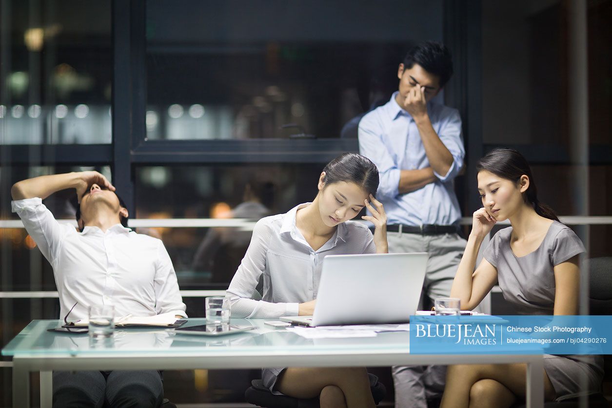 Tired Chinese business people having a meeting-High-res stock photo for ...