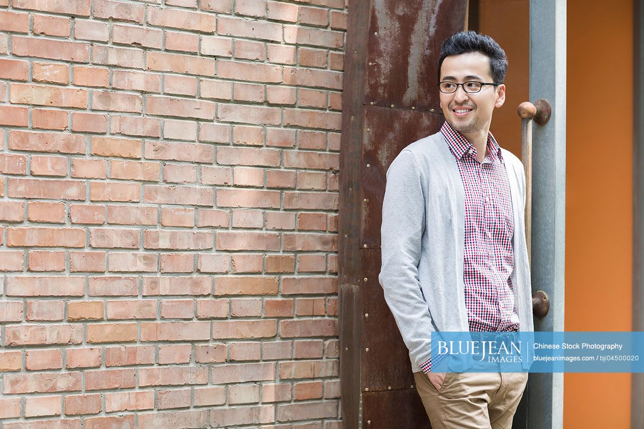 Mid adult Chinese man thinking-High-res stock photo for download