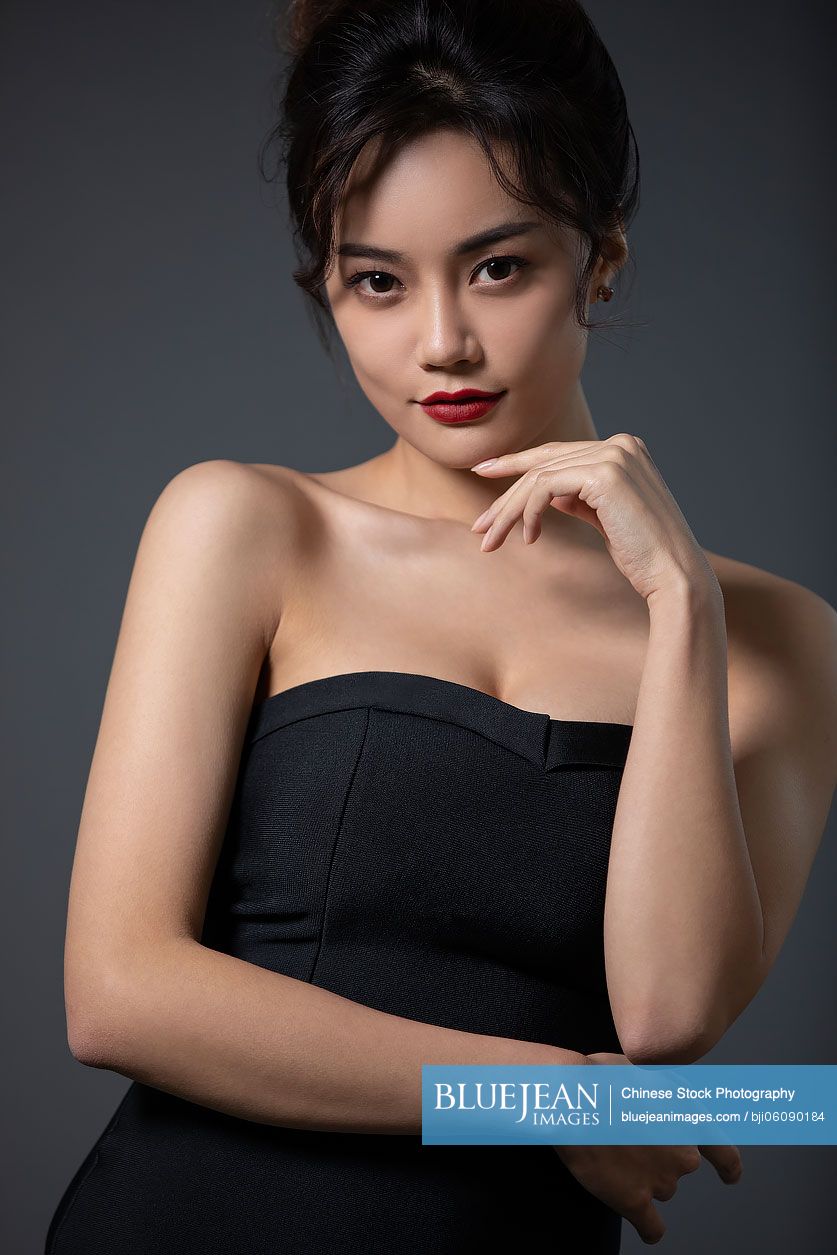 Beautiful young Chinese woman in black dress-High-res stock photo for download
