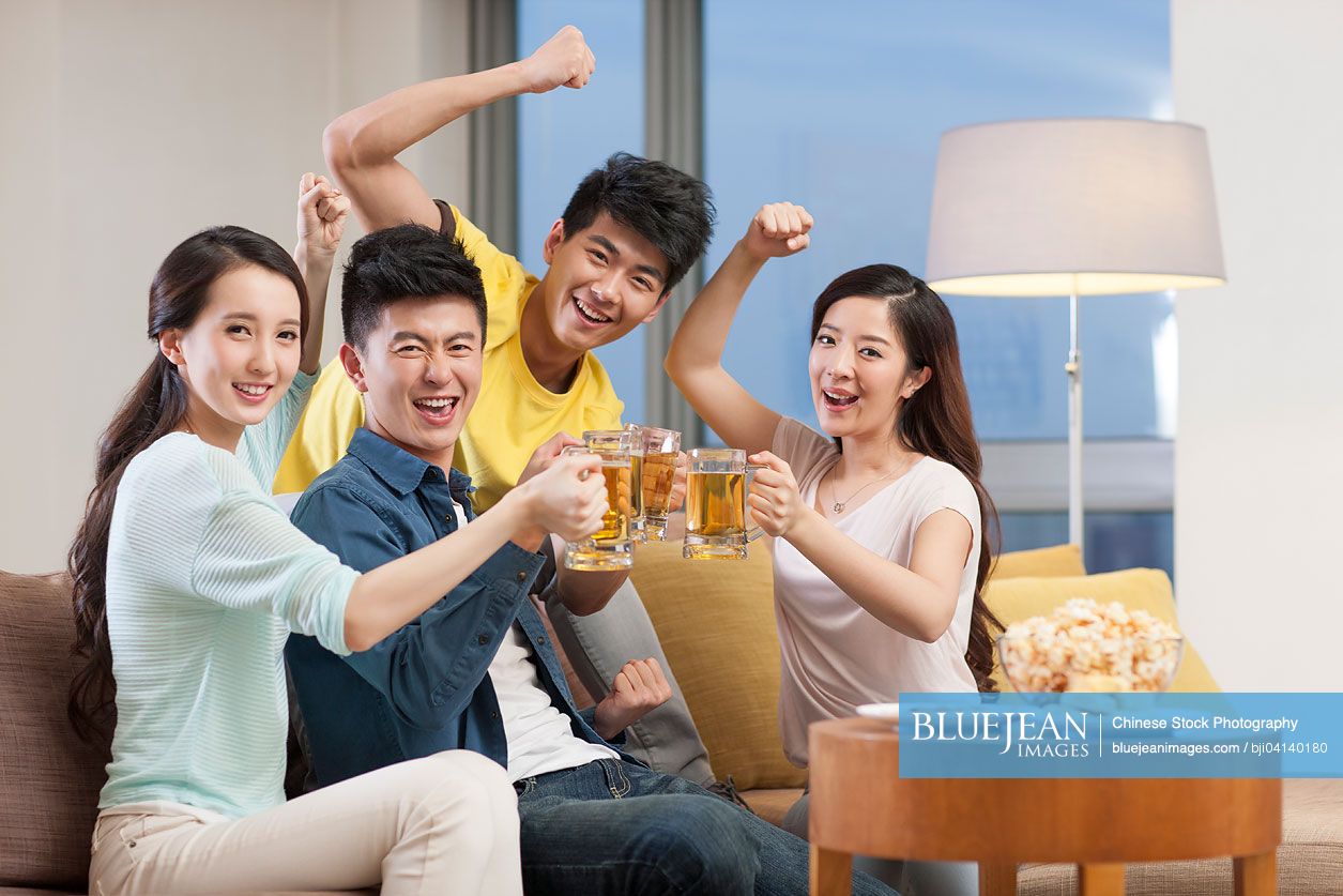 Cheerful young Chinese adults toasting with beer-High-res stock photo ...