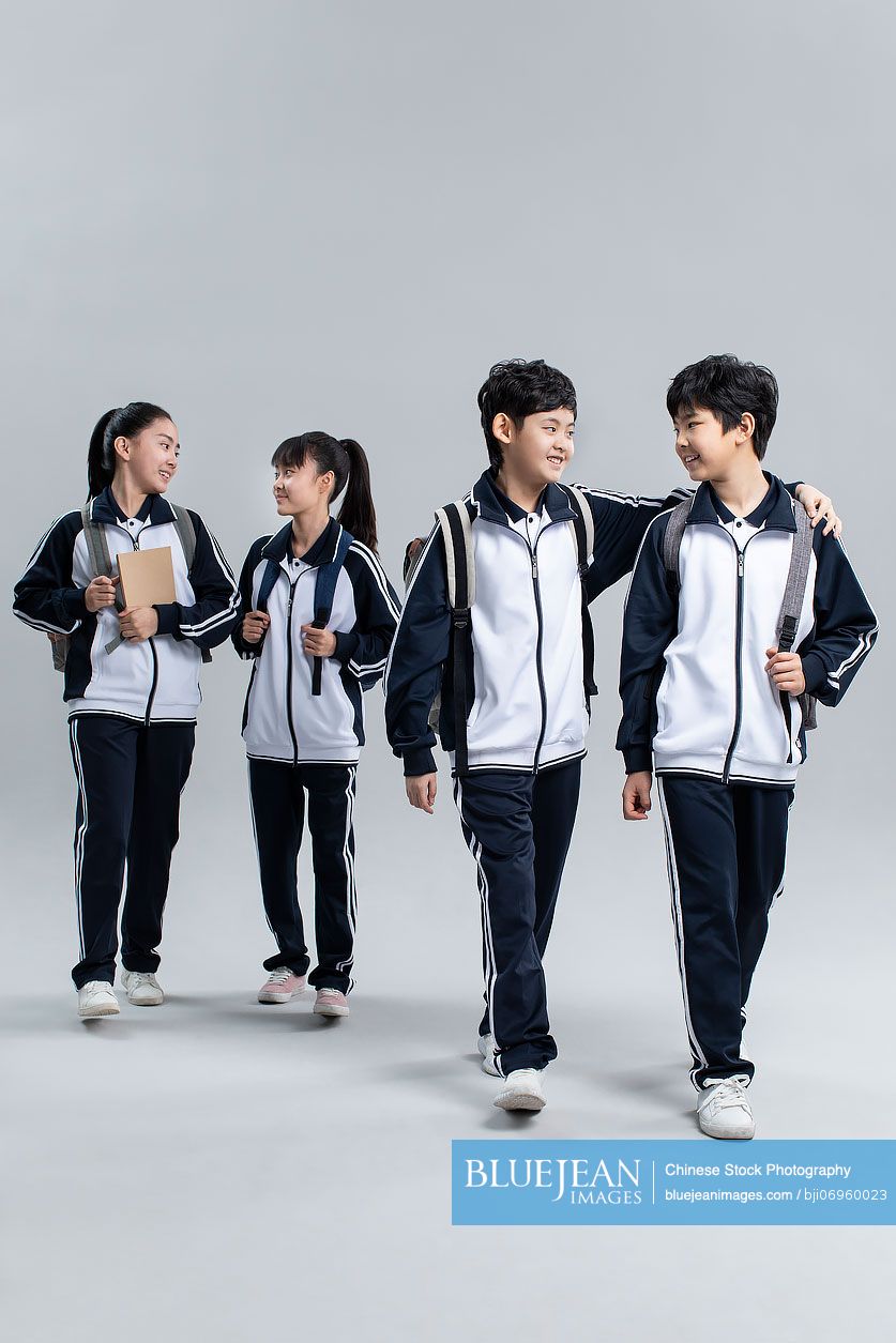Studio shot of cheerful Chinese students-High-res stock photo for download