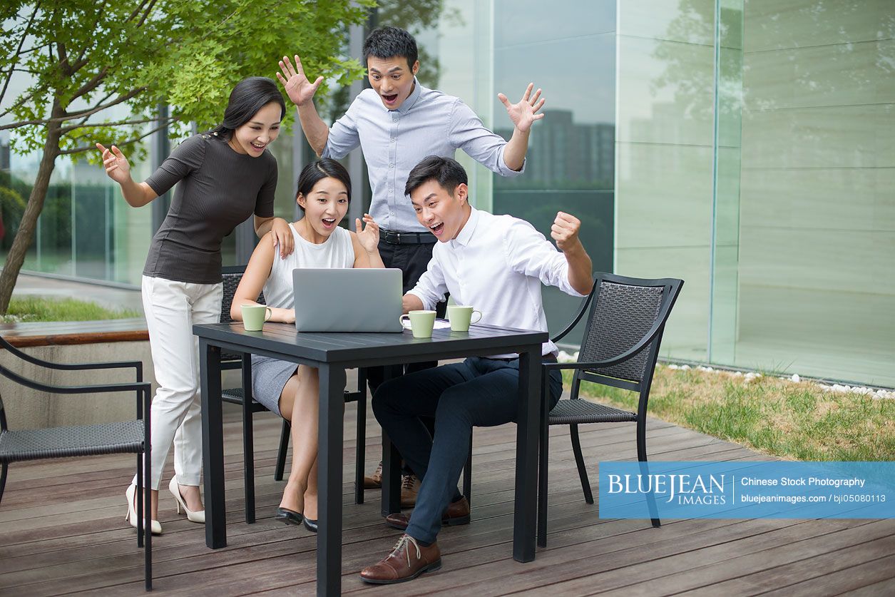 Young Chinese business person cheering outdoors-High-res stock photo ...