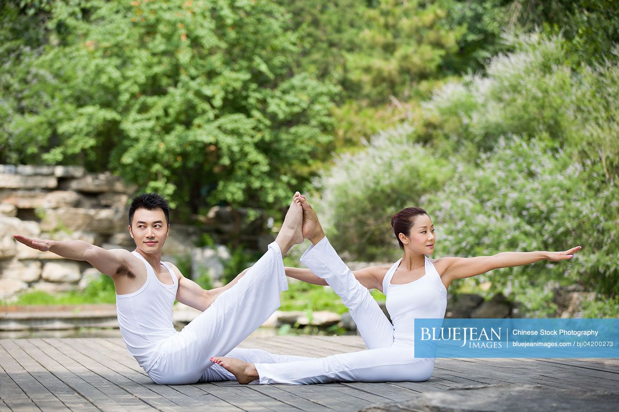 Young Chinese couple doing yoga-High-res stock photo for download
