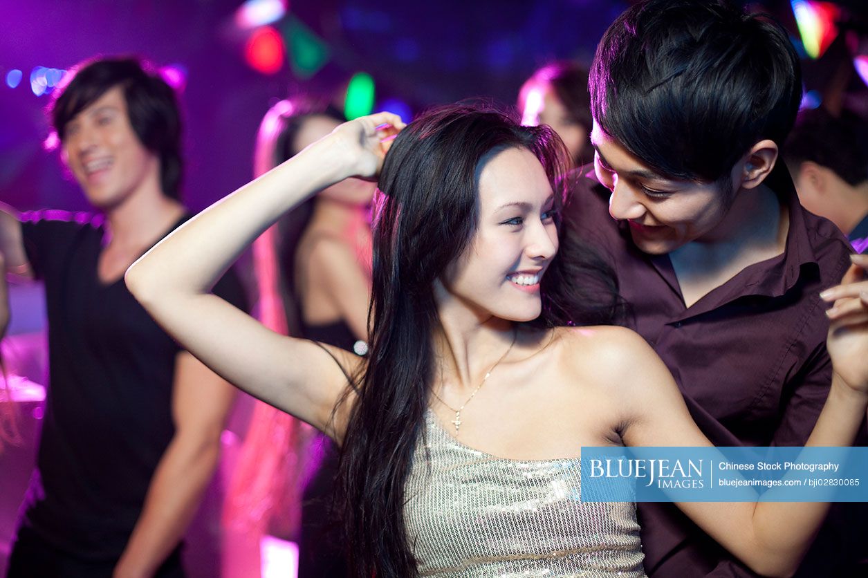 Stylish young Chinese dancing in nightclub-High-res stock photo for ...