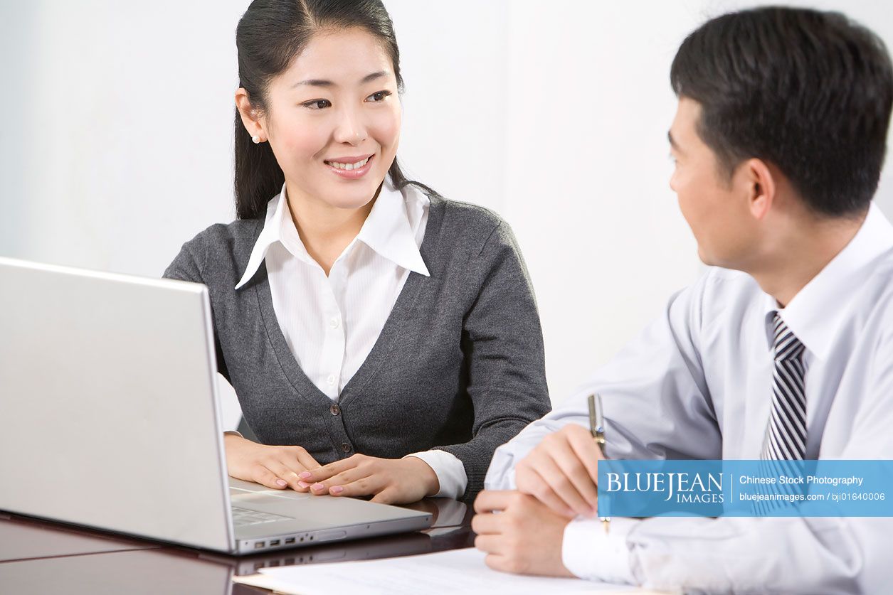 Chinese officemates working together-High-res stock photo for download