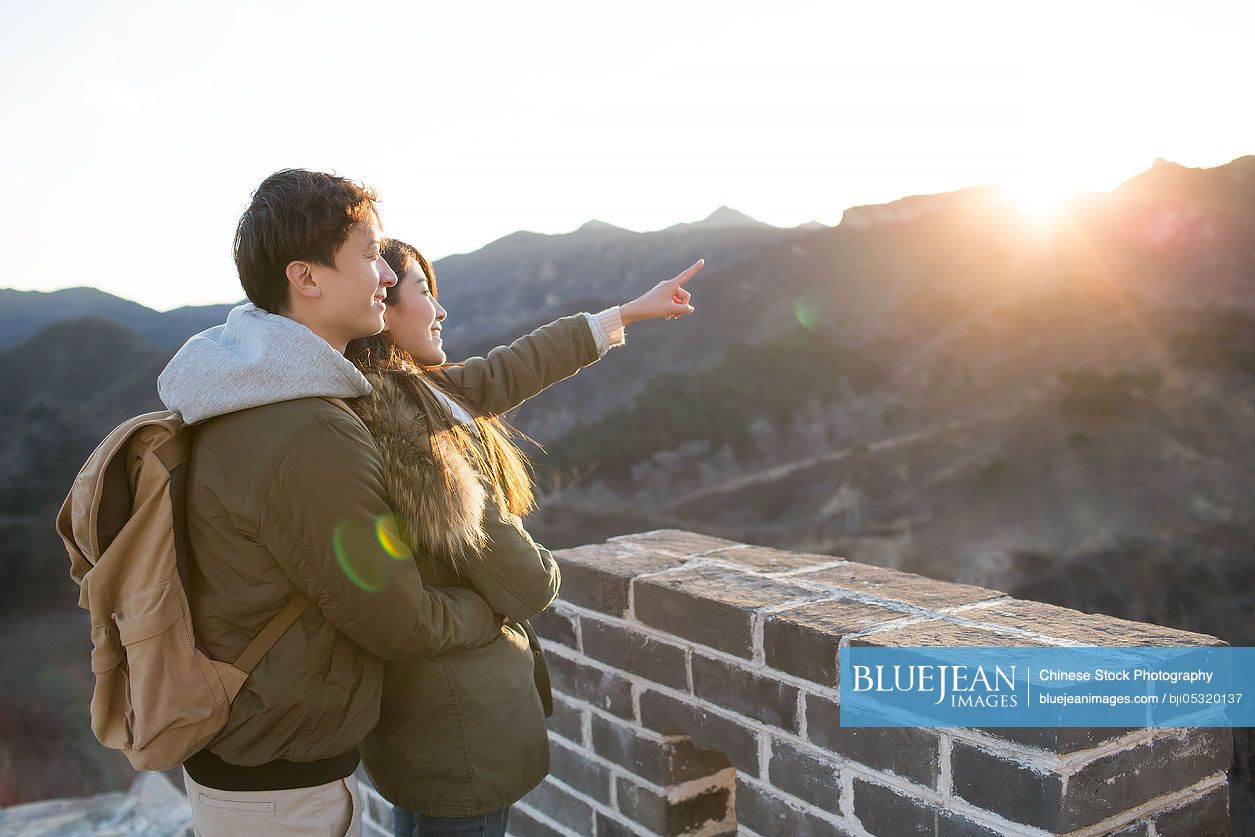 Happy young Chinese couple enjoying winter outing on the Great Wall-High-res stock photo for ...