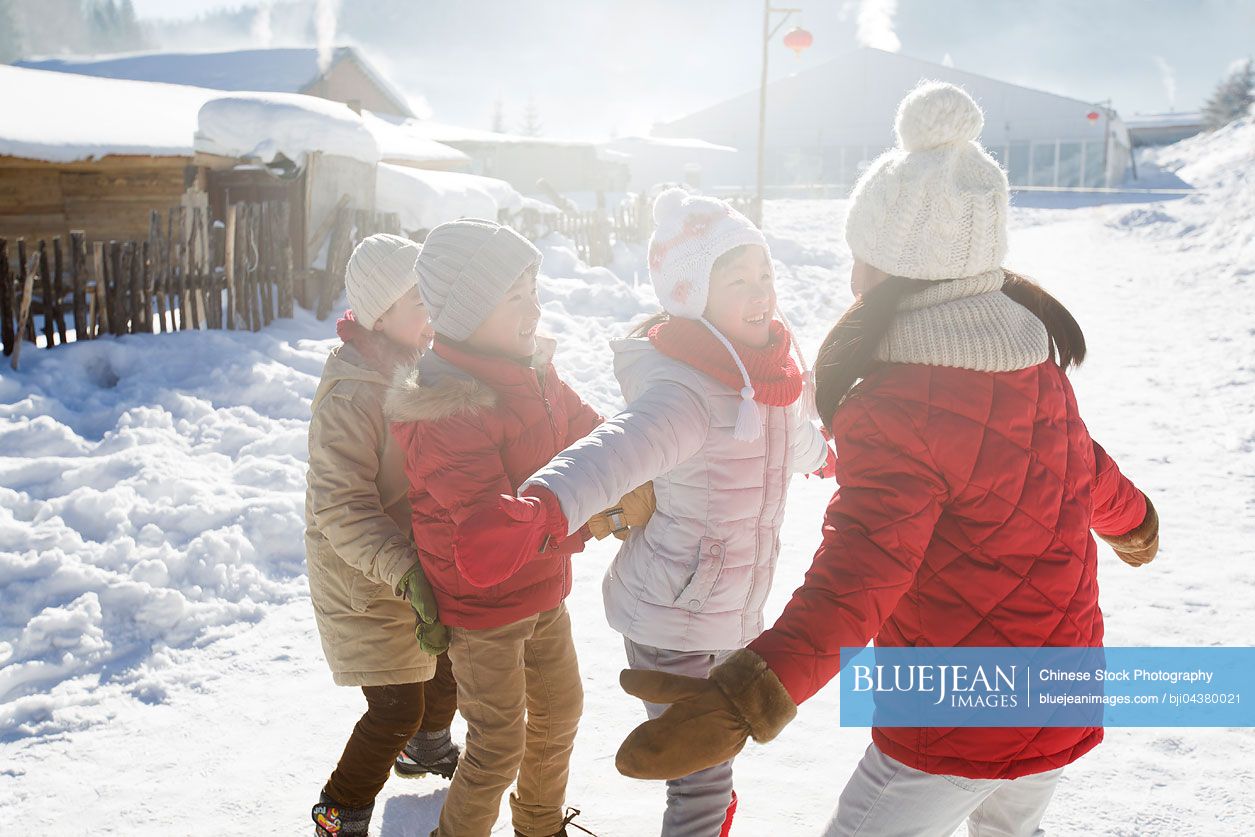 Happy Chinese children playing in the snow-High-res stock photo for ...