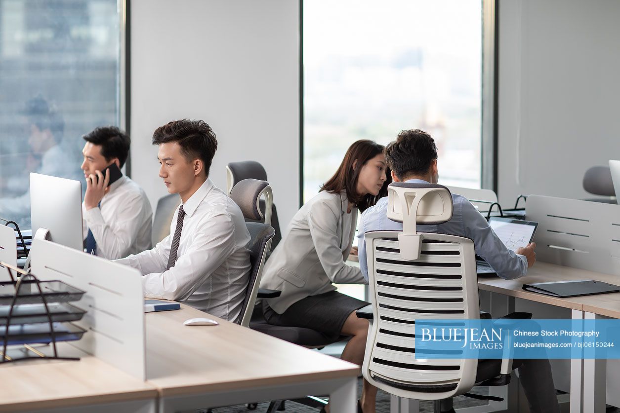 Chinese business people working in office-High-res stock photo for download
