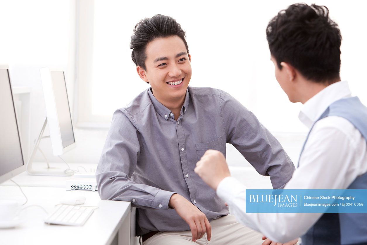 Cheerful Chinese business coworkers talking in the office-High-res ...