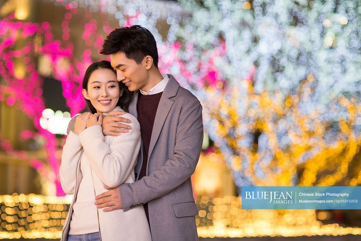 Cheerful young Chinese couple dating-High-res stock photo for download