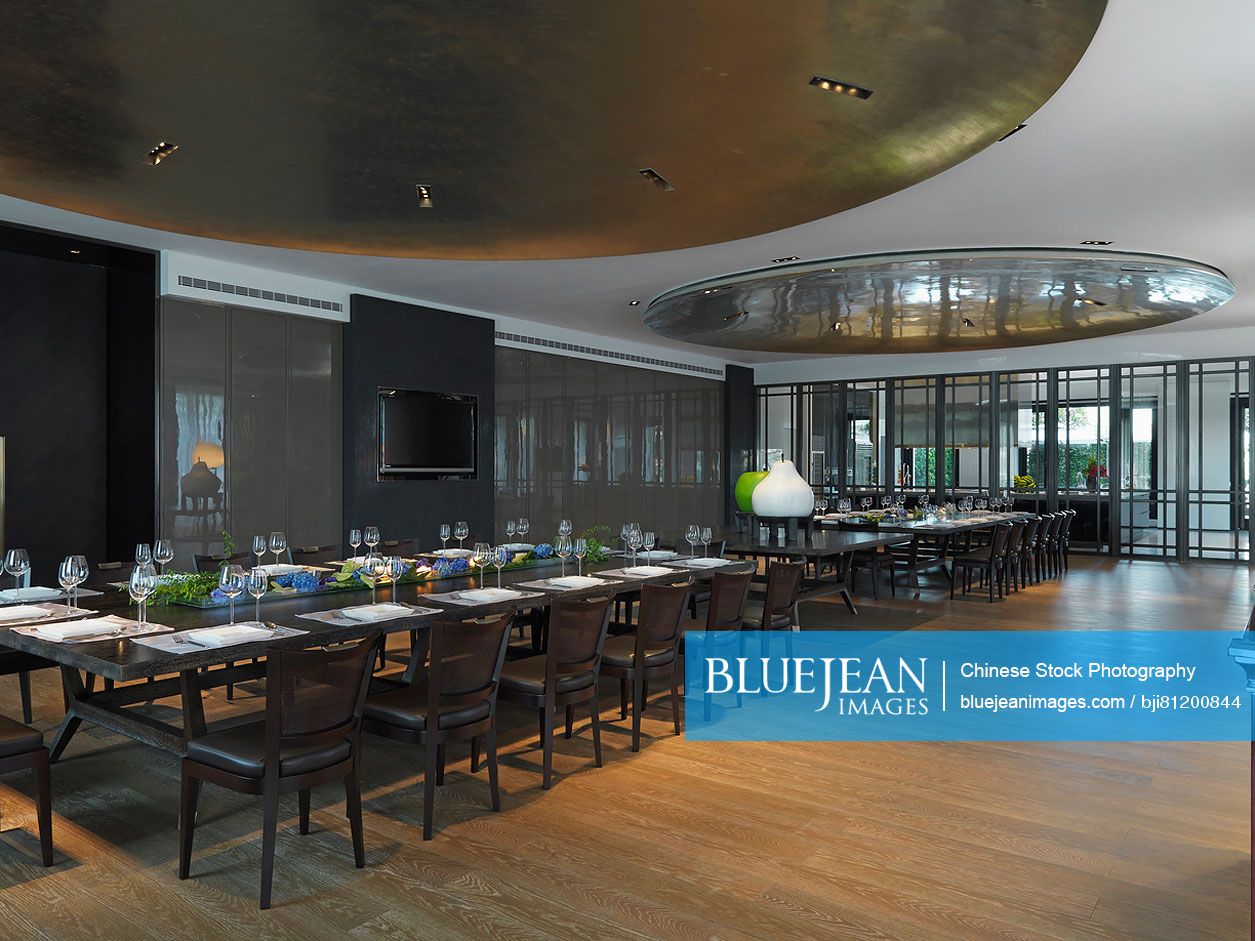 Large dining room tables with several place settings-High-res stock ...