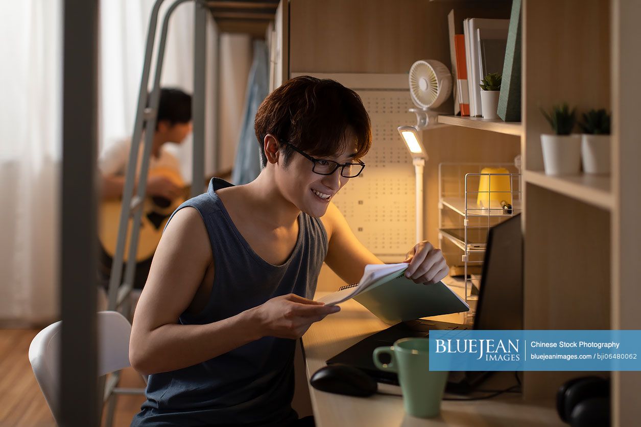 Young Chinese university student learning in dormitory-High-res stock ...